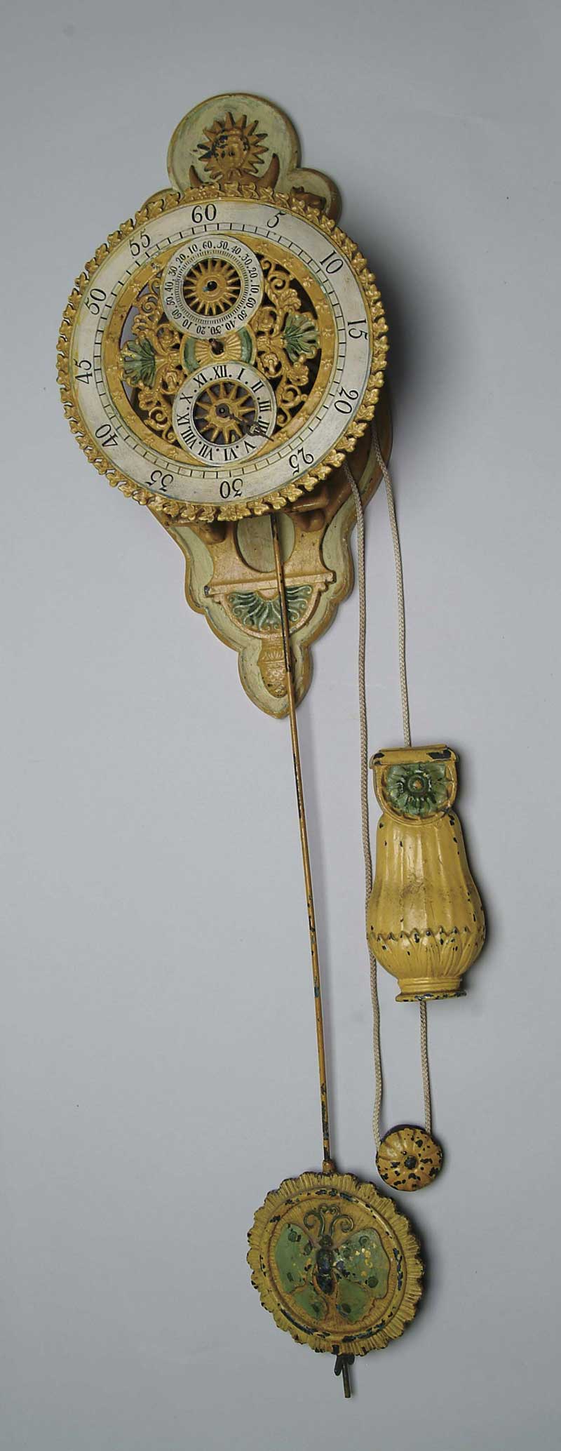 INTERESTING AND RARE CAST IRON CLOCK DESIGNED BY BENJAMIN FRANKLIN.